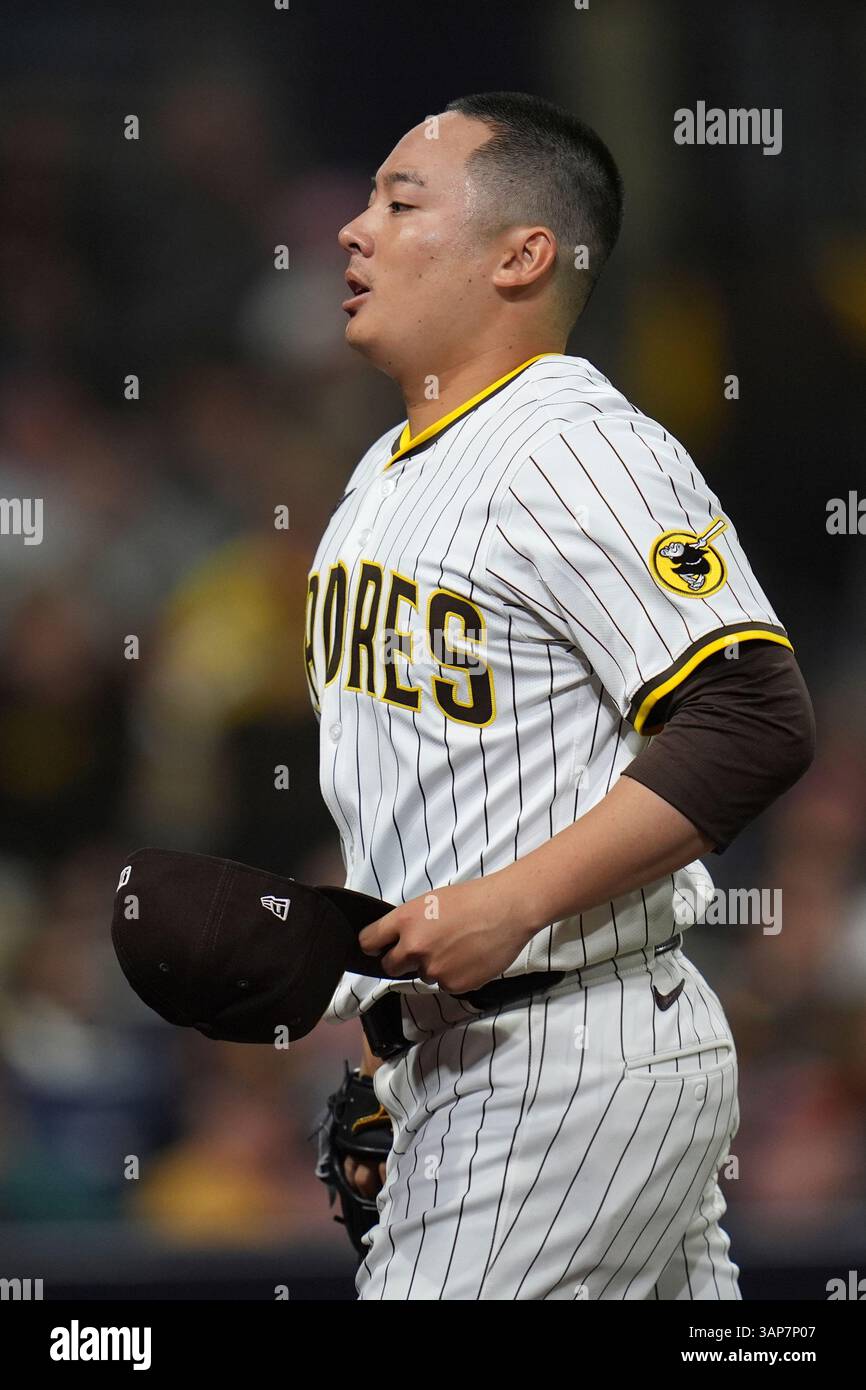 San Diego Padres relief pitcher Yuki Matsui heads towards the dugout ...