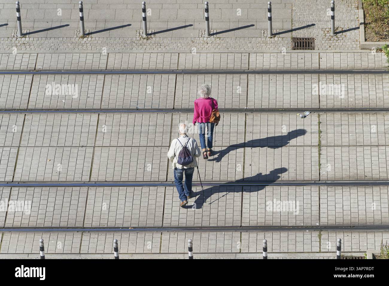 Old pensioner couple on their way through the city centre Stock Photo ...