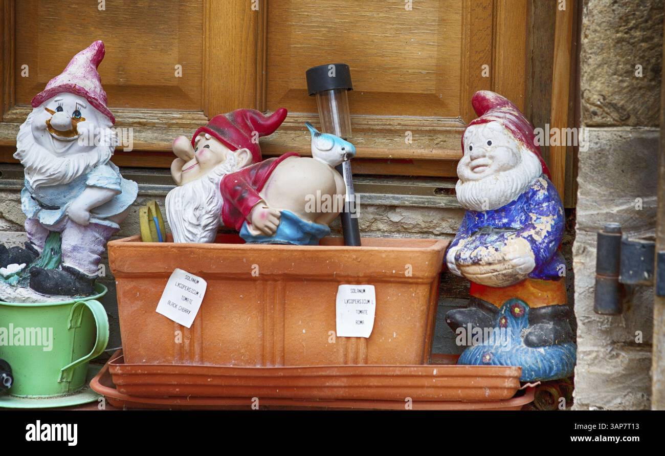 Garden gnomes in front of a door in a French village, 2019 Stock Photo ...