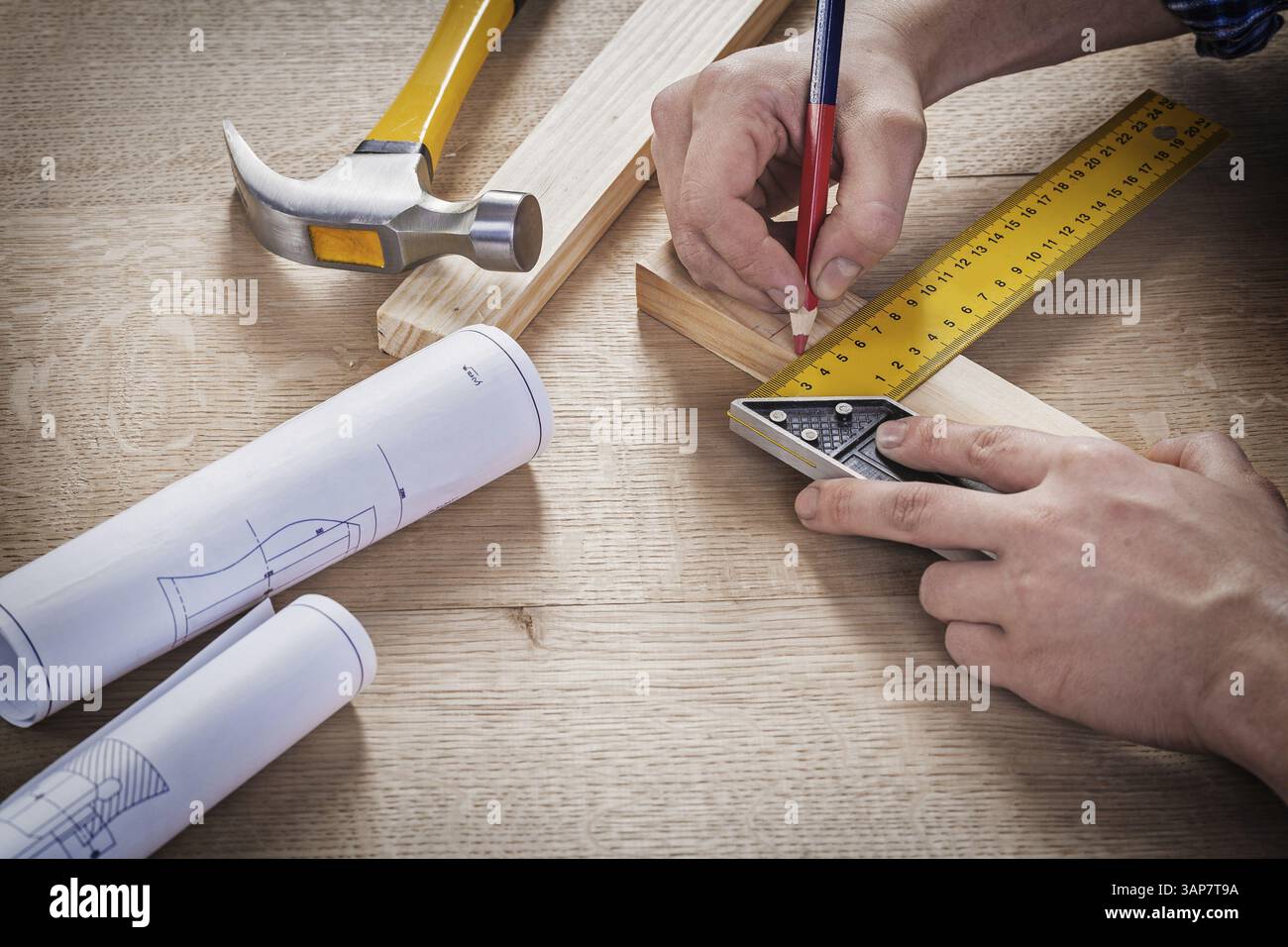 Hands of carpenter drawing with pencil on wooden plank Stock Photo - Alamy