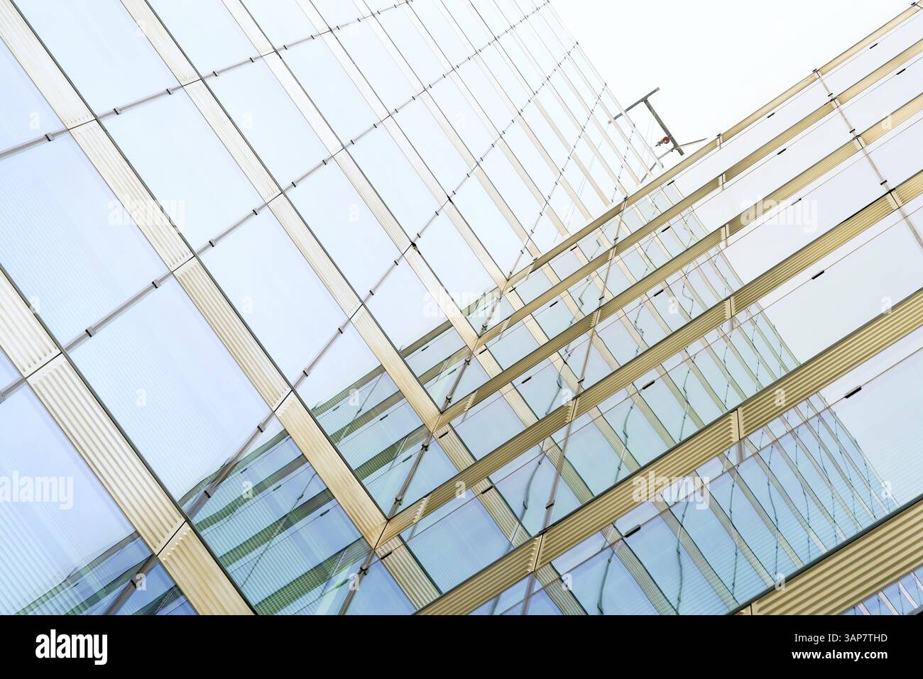 Reflection in the glass facade of two connected office buildings in the ...