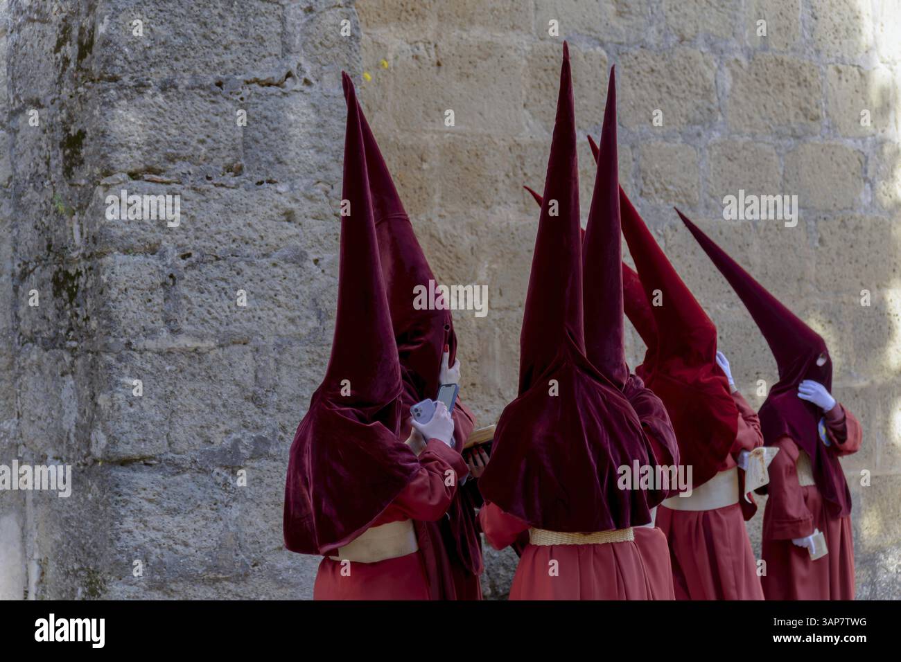 Group of nazarenes, also known as penitents, wearing traditional ...