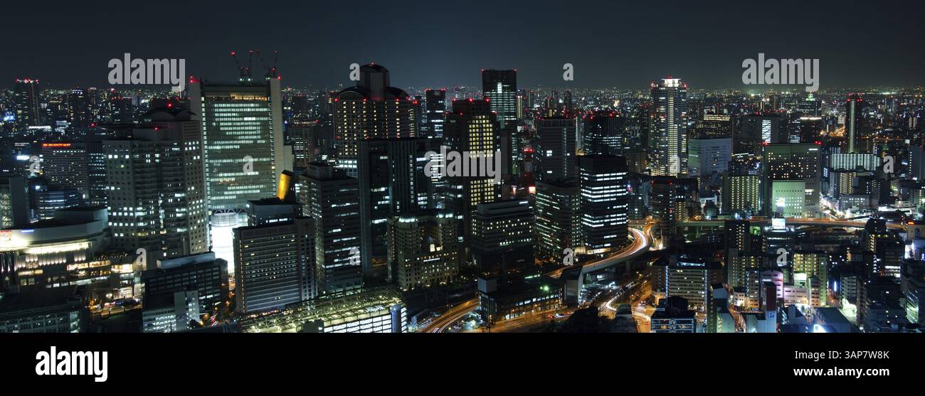 Panorama skyline of Osaka City in Japan at night with lots of lights ...