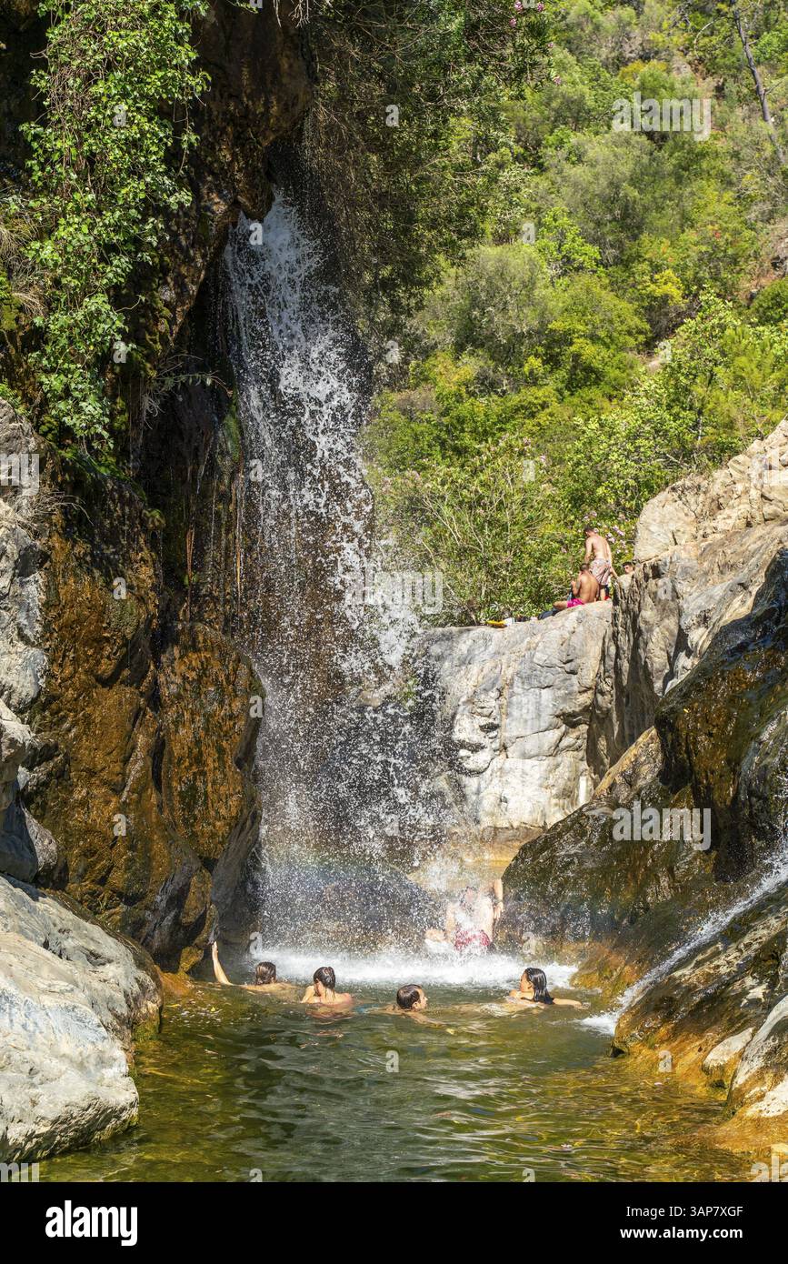 Men and woman bathing in the natural rock pools and waterfalls of ...