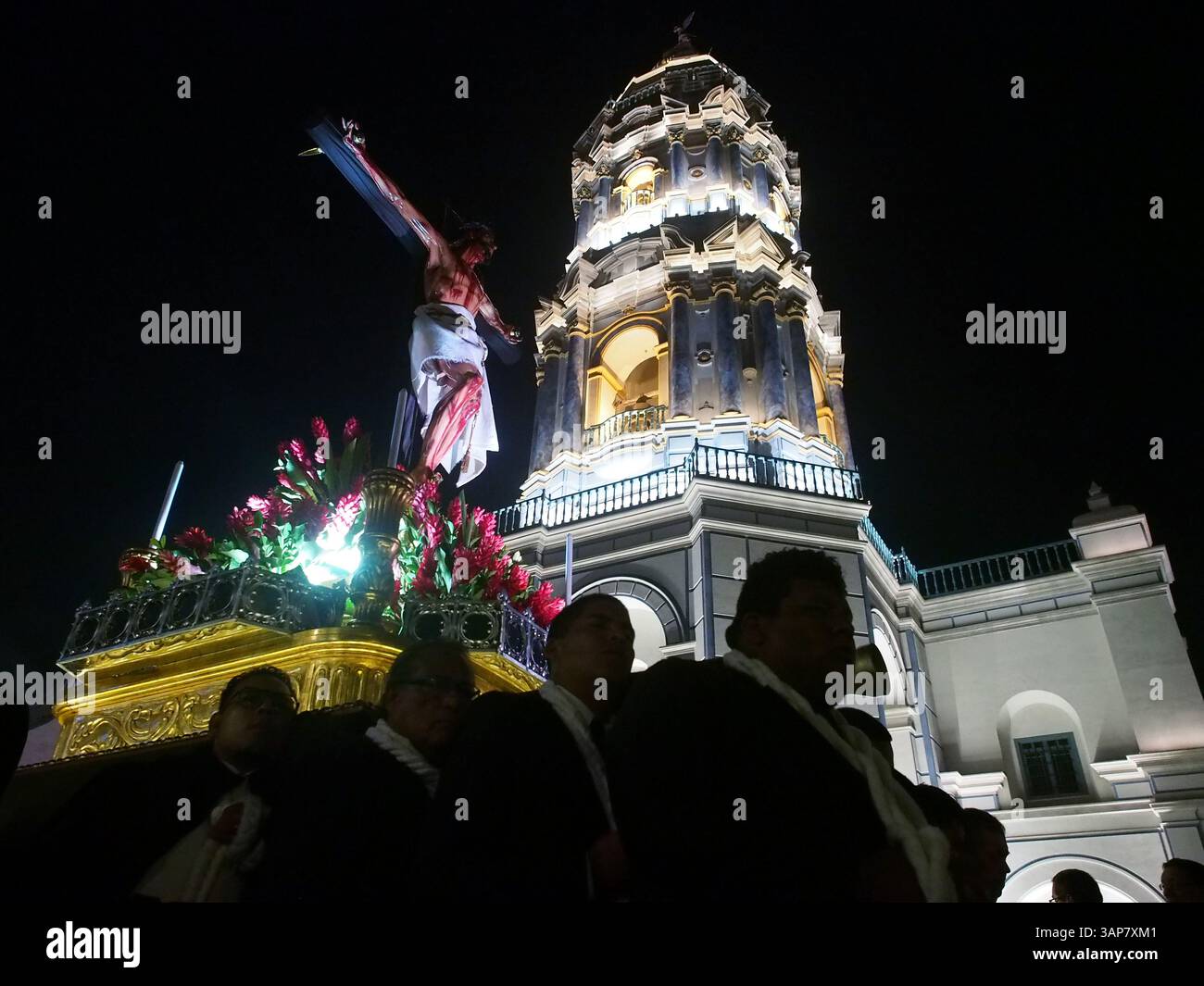 Devotees carrying a religious image in front of the Basilica of Our ...