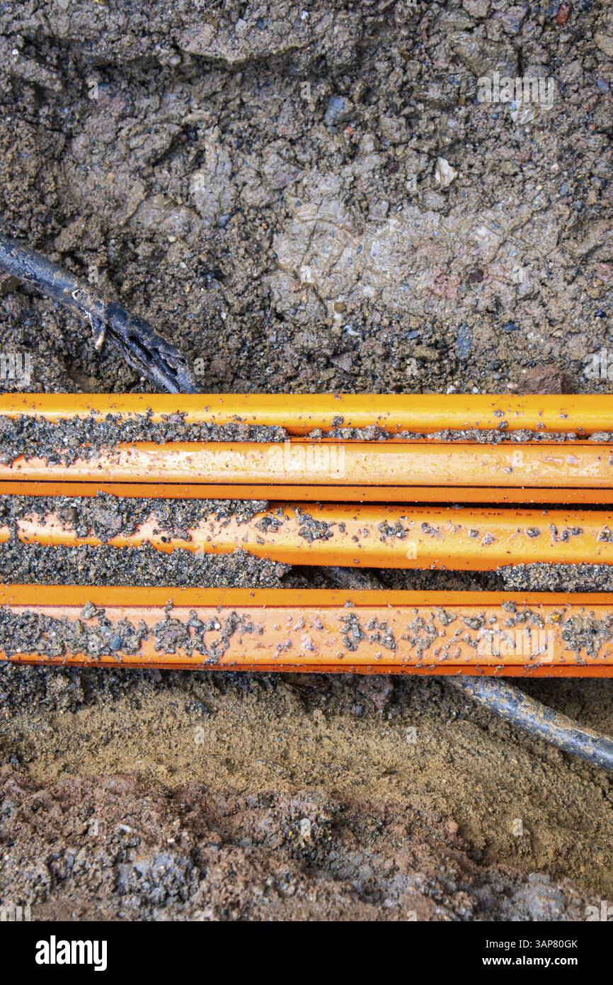 Damaged underground cable during excavation work for fibre optic cable ...