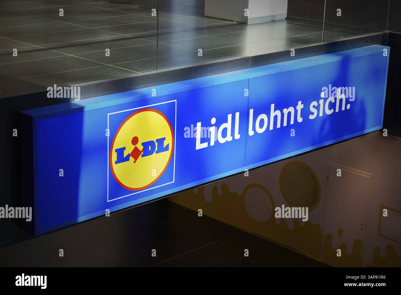 Illuminated advertising for the Lidl food discounter Stock Photo - Alamy