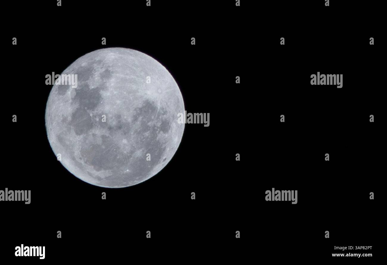 The Full Moon on April 2025, a micromoon at apogee, as seen in the ...
