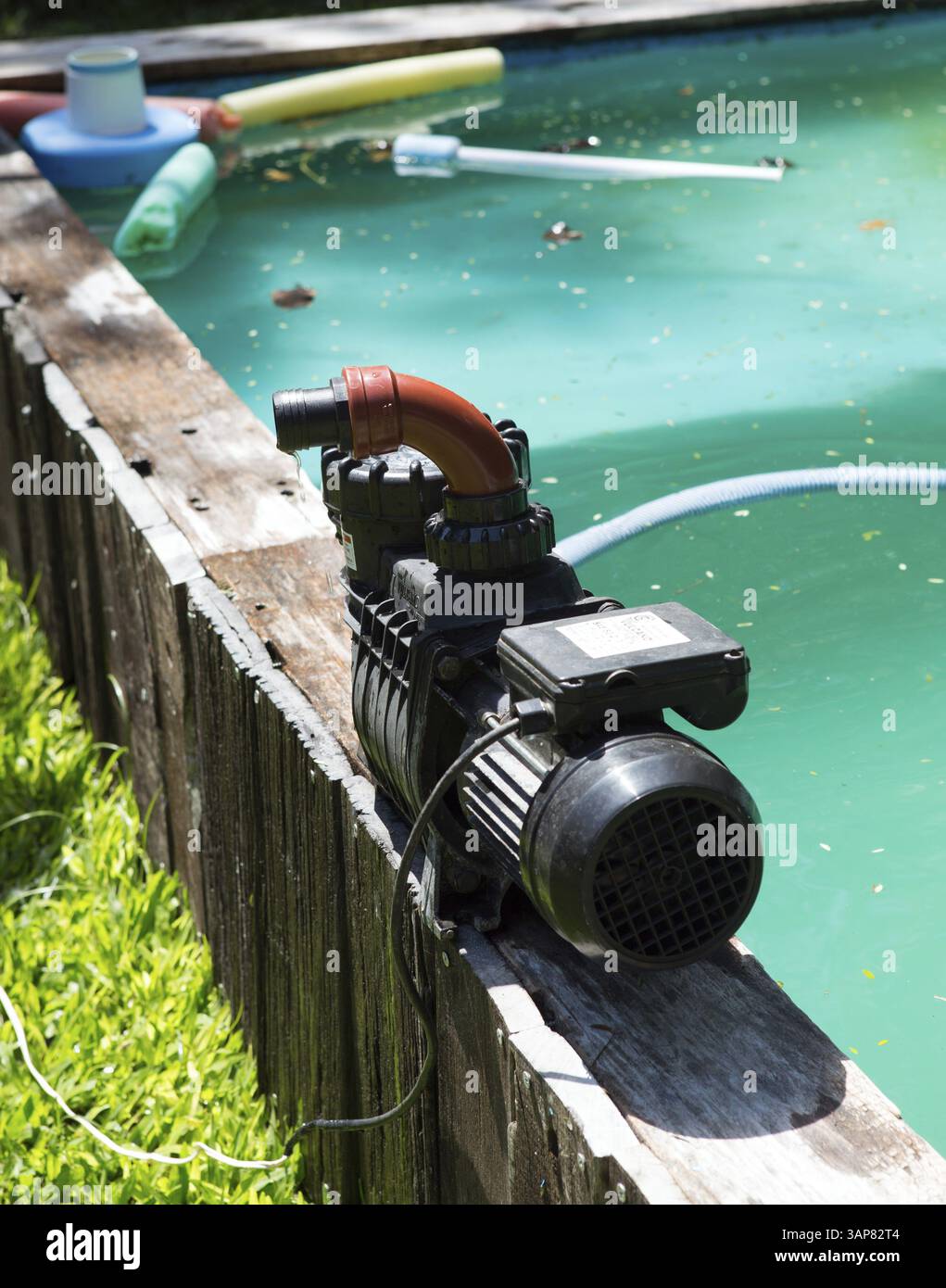 Pump for cleaning at the edge of a pool, 2016 Stock Photo - Alamy