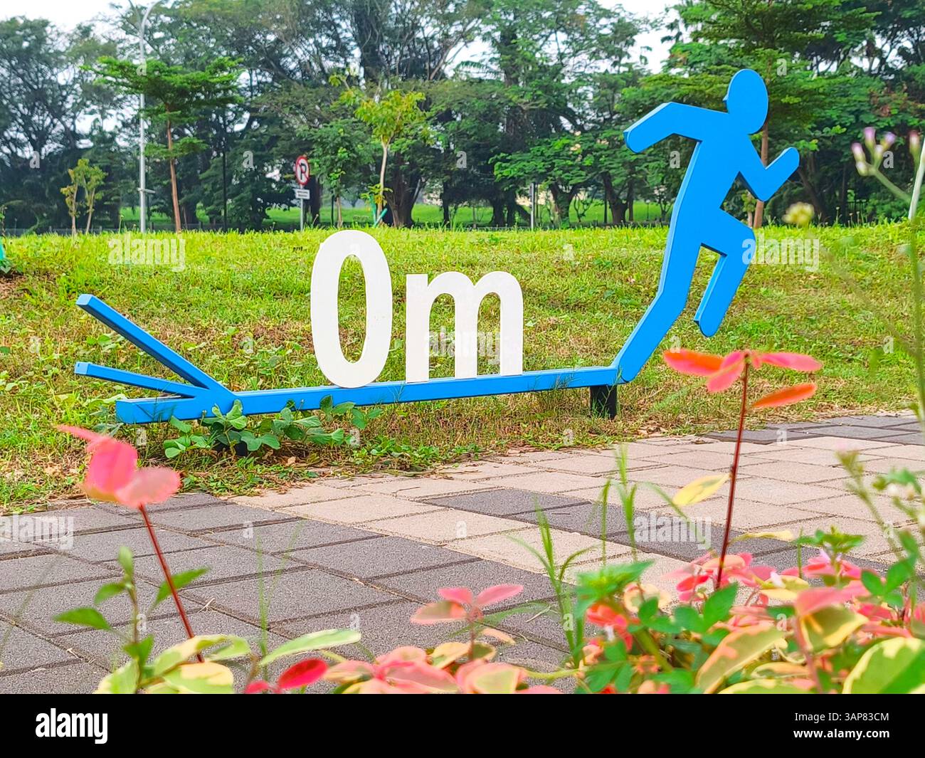 A zero point sign on a running track in a sports area Stock Photo - Alamy