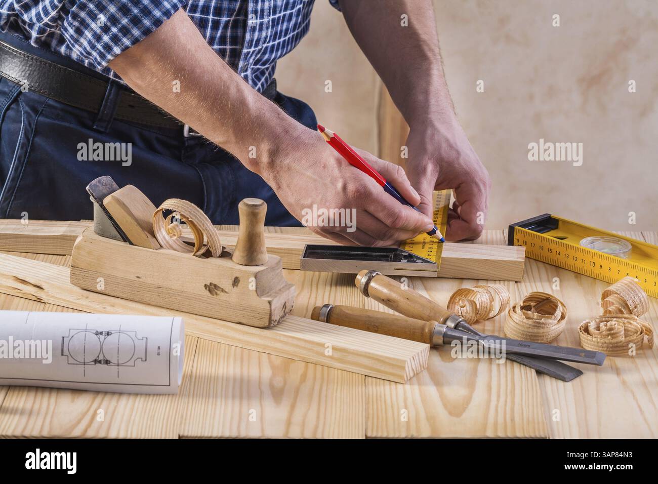 Hands of joiner with pencil Stock Photo - Alamy