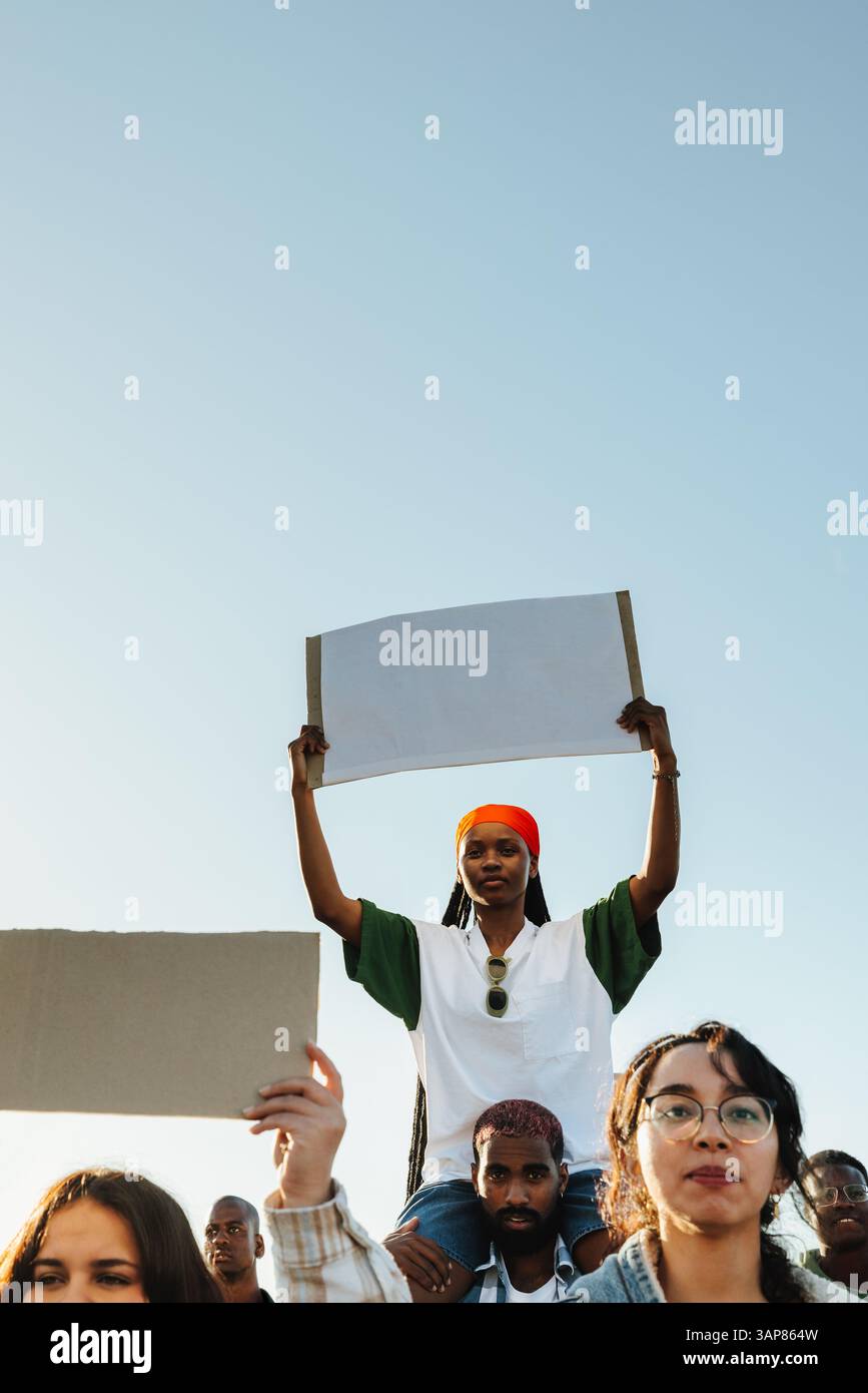 Group of activists holding blank signs, taking a stand against ...
