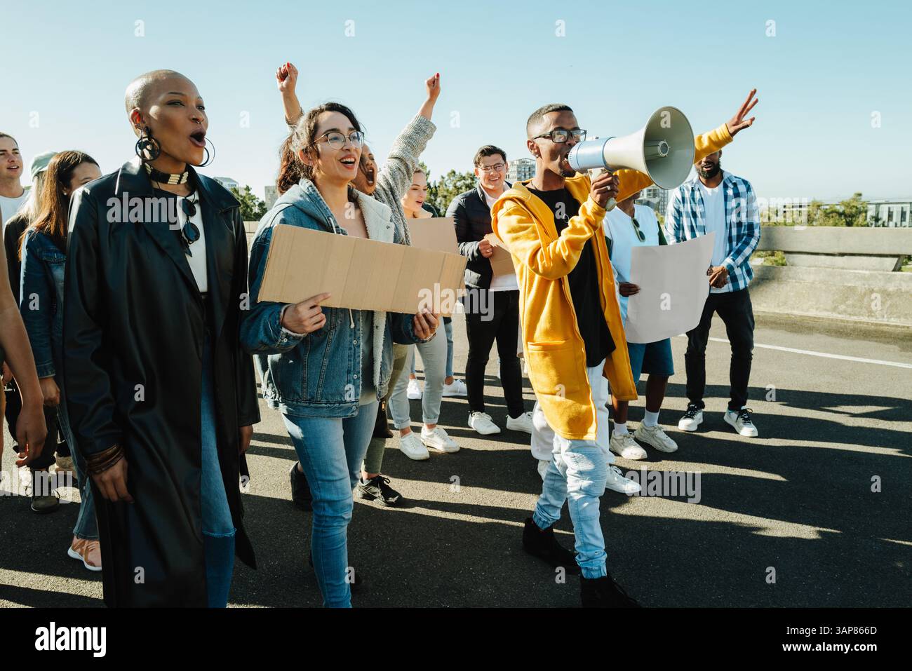A diverse group of people engaging in a peaceful street protest ...