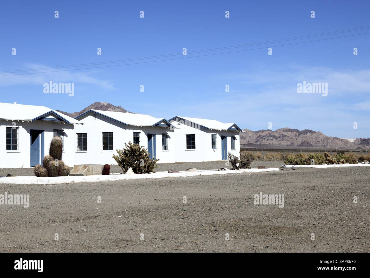 White houses of an abandoned 80s motel in the Californian desert, USA ...