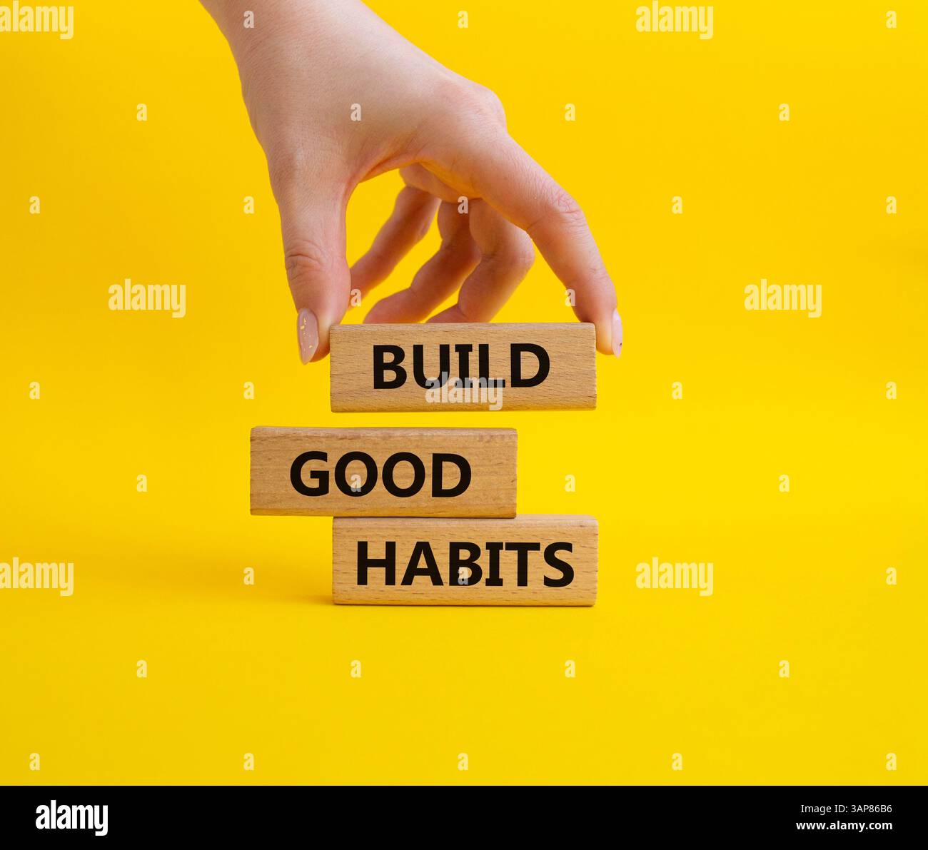 Build good habits symbol. Wooden blocks with words 'Build good habits ...