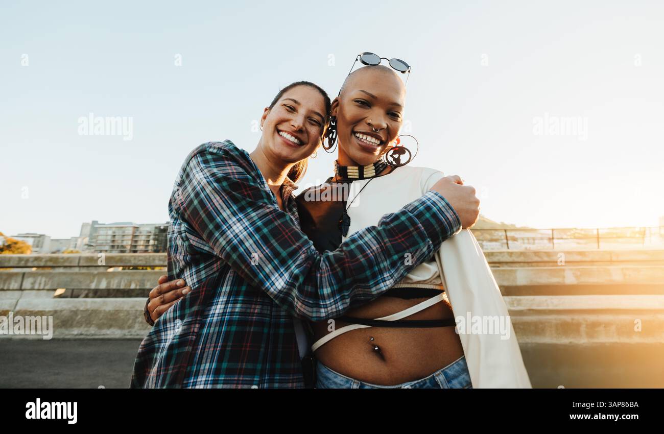 Two women are pictured smiling, embracing, and radiating joy. The image ...