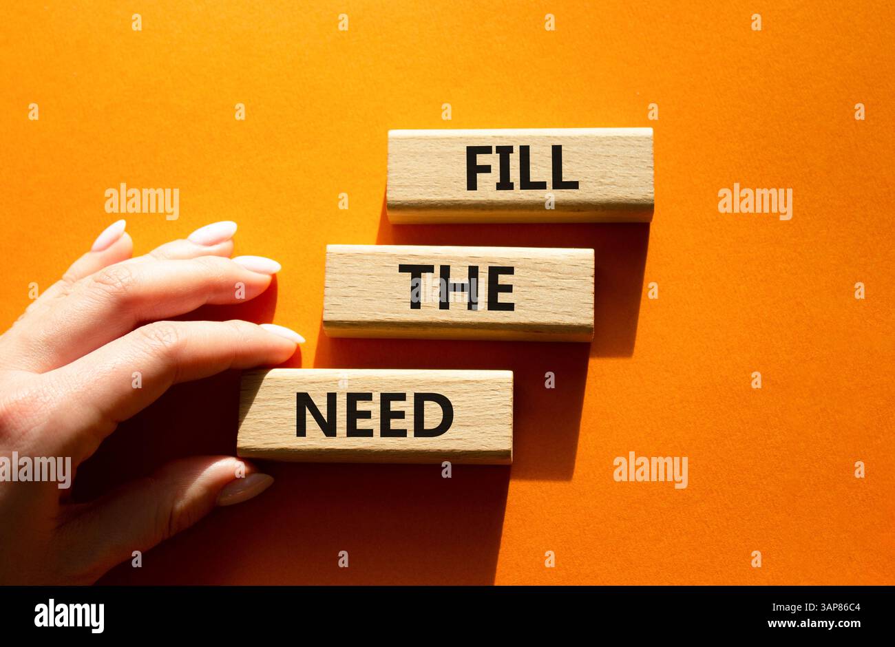 Fill the need symbol. Concept word Fill the need on wooden blocks ...
