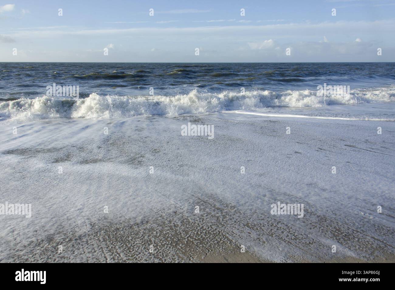 Beach at the North Sea on the Island Sylt in Germany with waves and ...