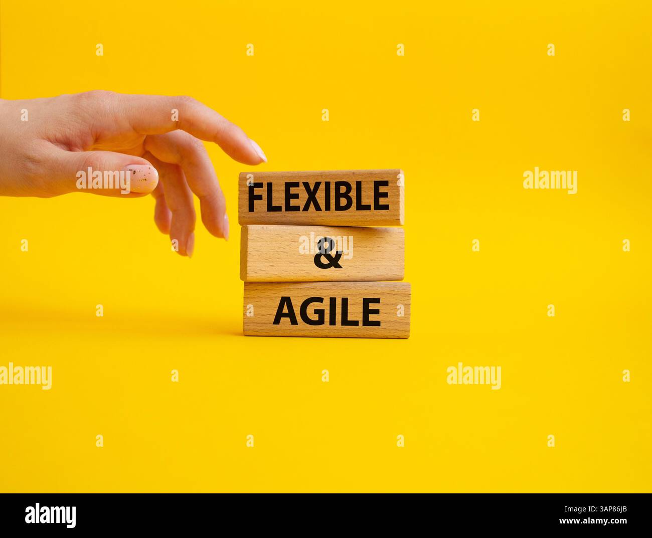 Flexible and agile symbol. Concept word Flexible and agile on wooden ...