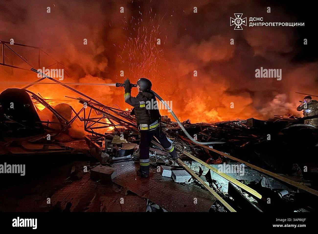 In this photo provided by the Ukrainian Emergency Service, firefighters ...