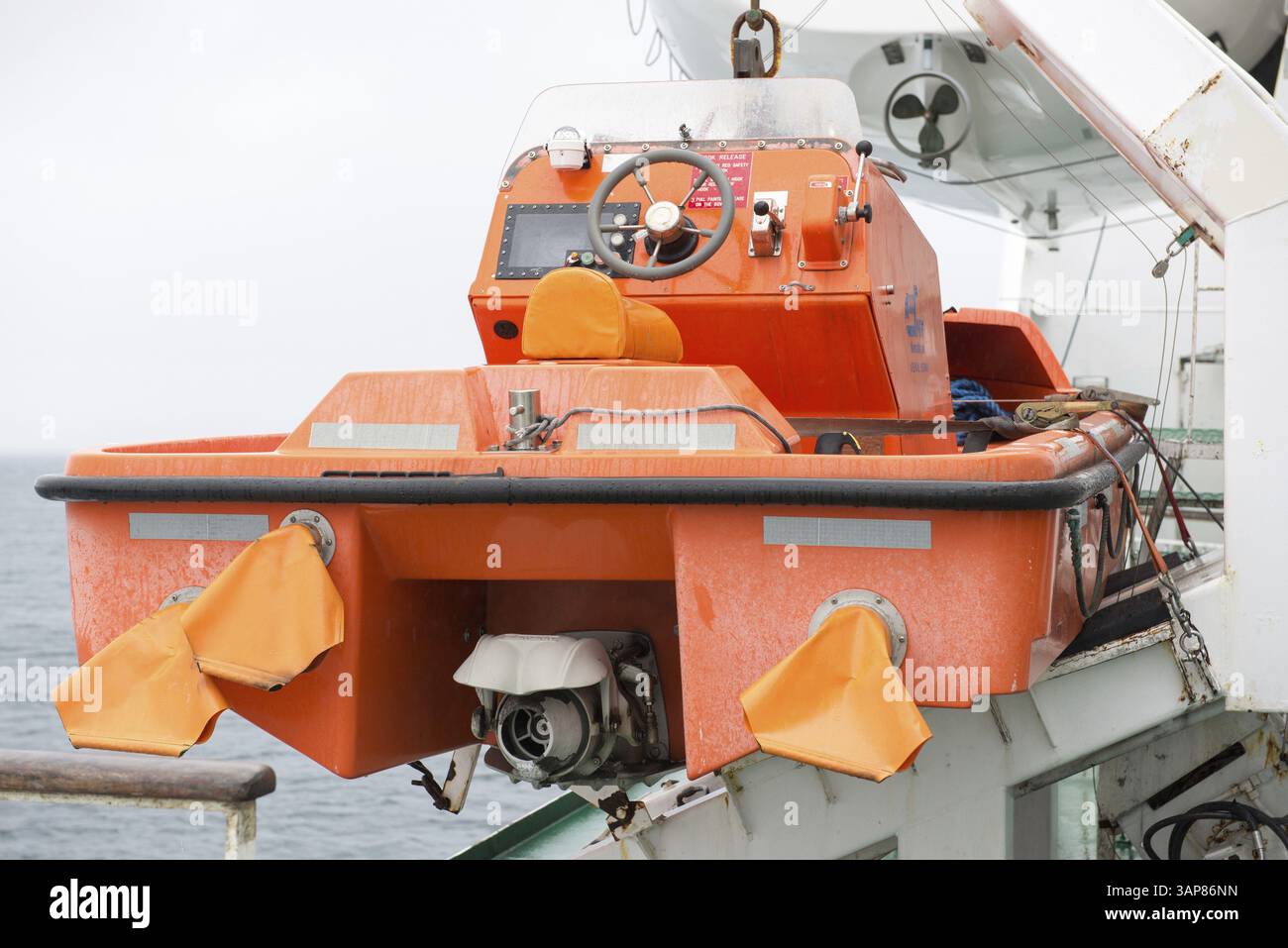 Orange lifeboat on the ferry ship MS Smyril on the Faroe Islands ...