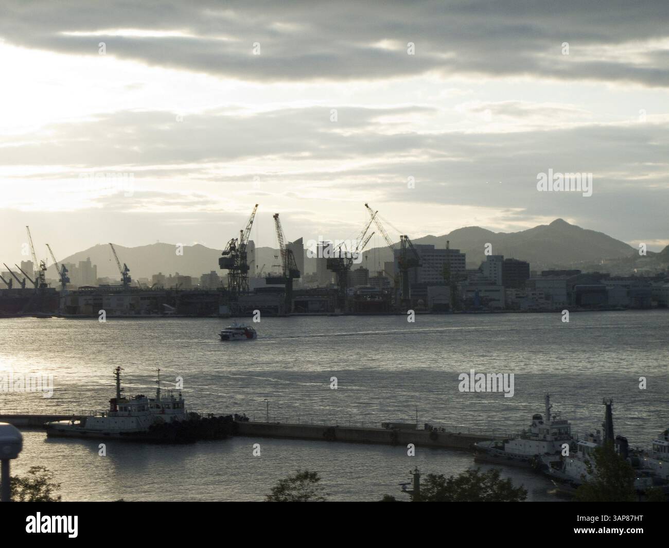 The port of Kobe in Japan with Awaji Island in the background, Kobe ...
