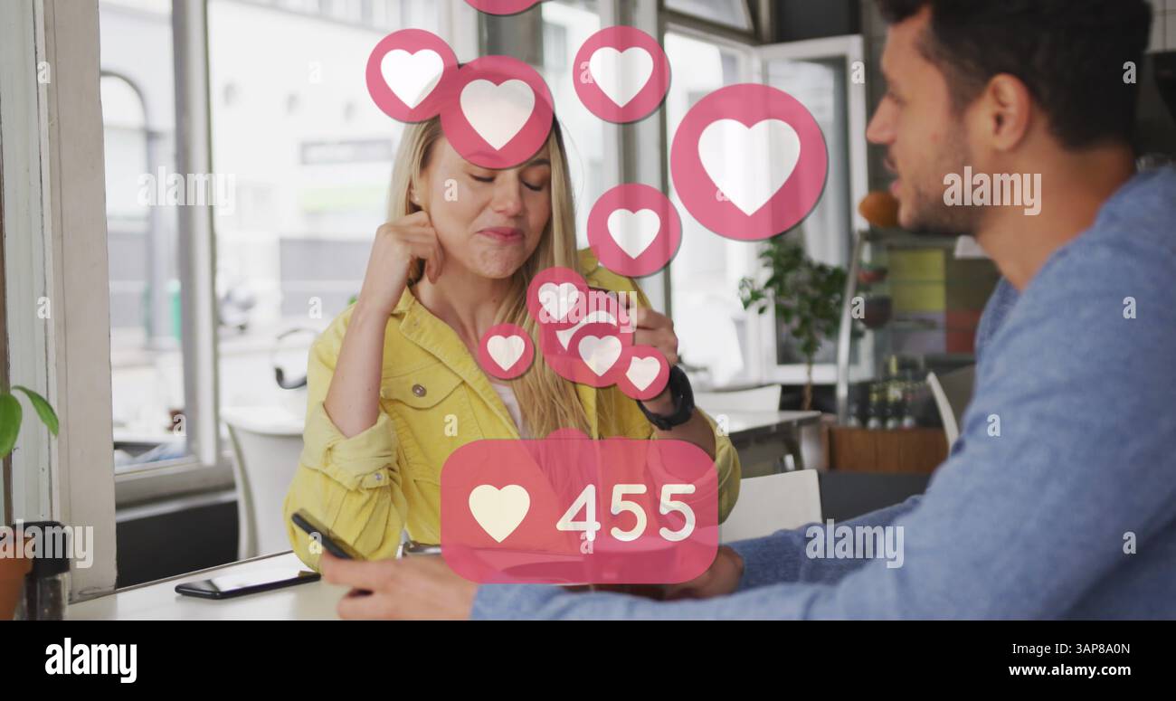 Image of heart icons floating over caucasian couple in love drinking ...