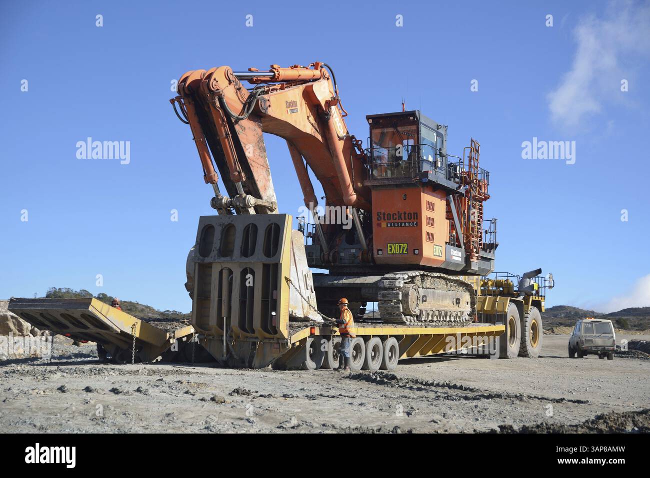 Men load a 190 ton digger onto a custom-built 48 wheel transporter at ...