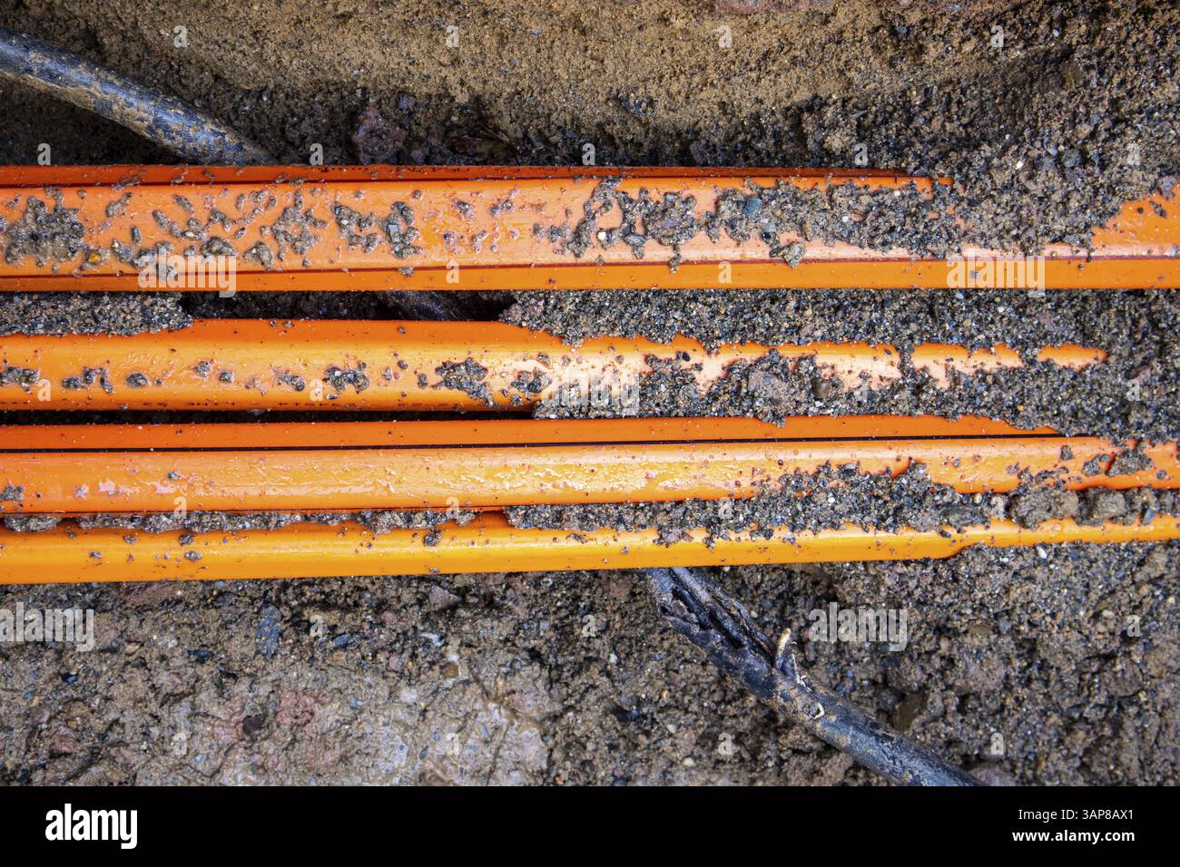 Damaged underground cable during excavation work for fibre optic cable ...