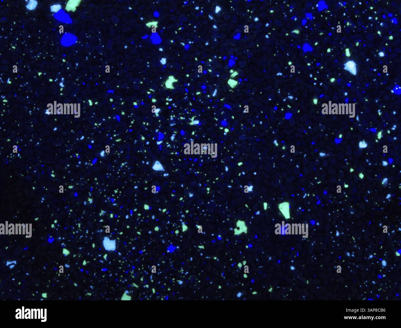 Spots of fluorescent stones in a pavement background pattern, Osaka ...