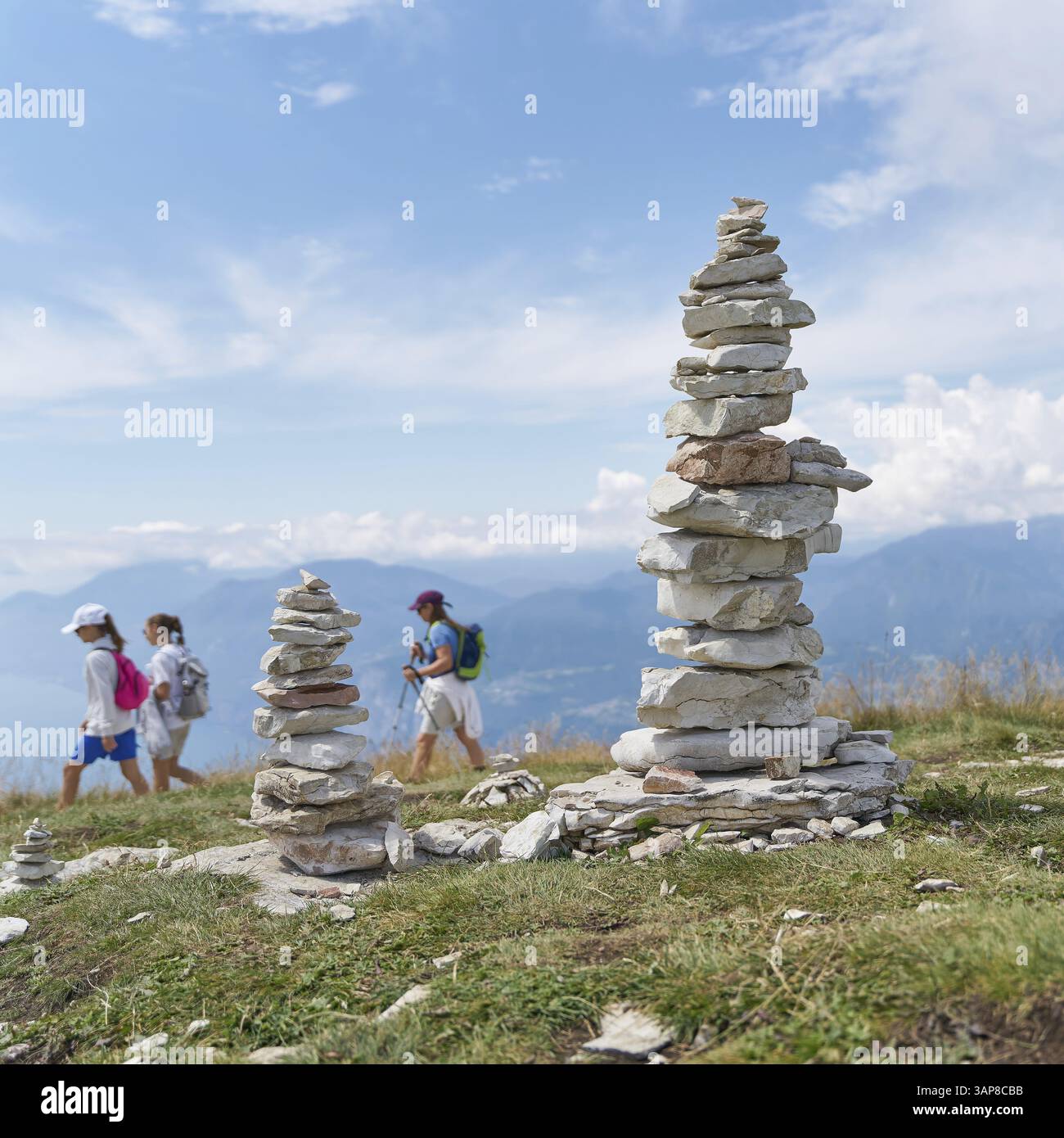 Stones piled up up by tourists and a few hikers on the summit of Monte ...