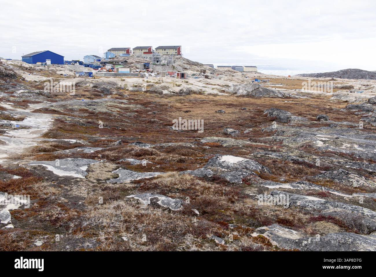 Ilulissat in Greenland as seen from the land side and with colorful ...
