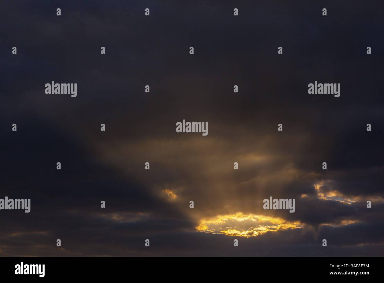 Texture sky dark clouds with cloud hole and translucent sun Stock Photo ...