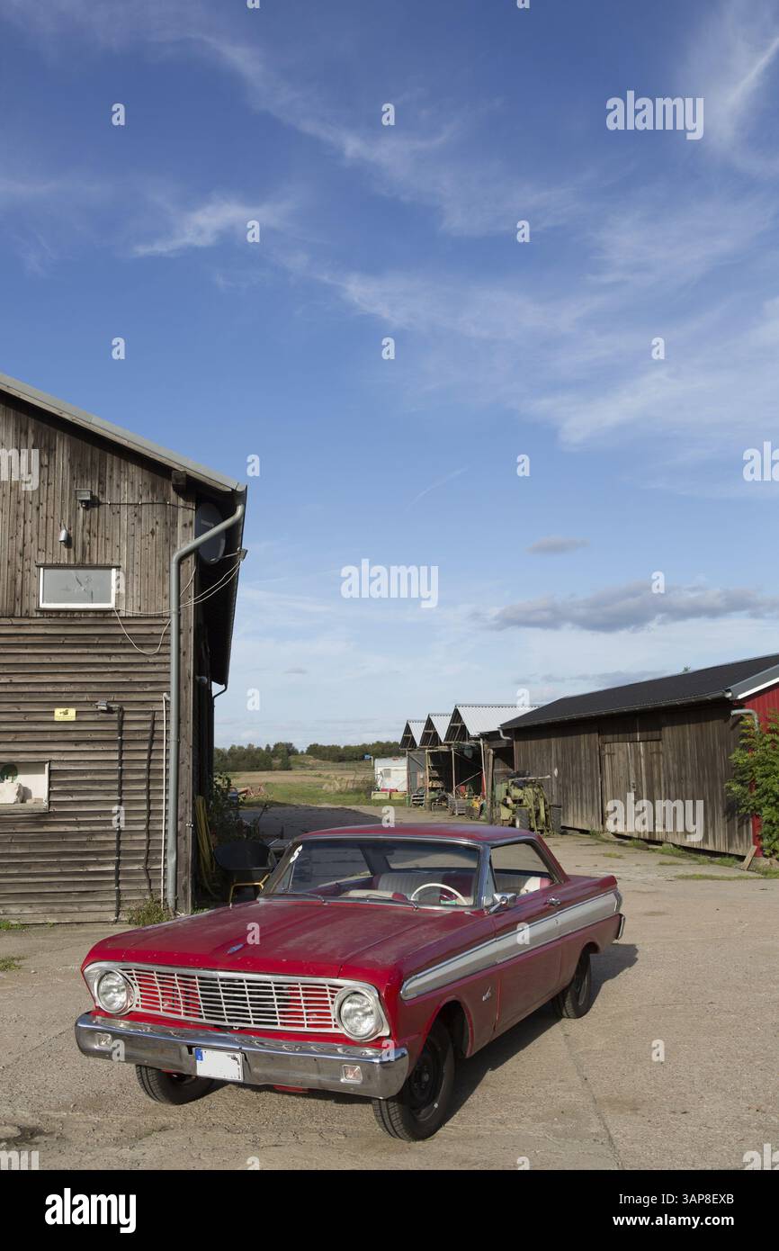 Red Ford Falcon Futura in a yard in Hamburg, 2019 Stock Photo - Alamy