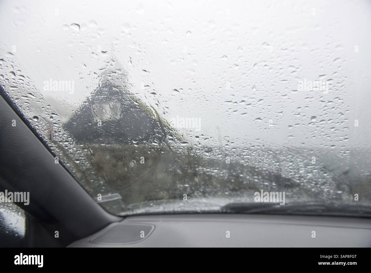 The front window of a car in heavy rain on a rainy day, KollafjorÃ°ur ...