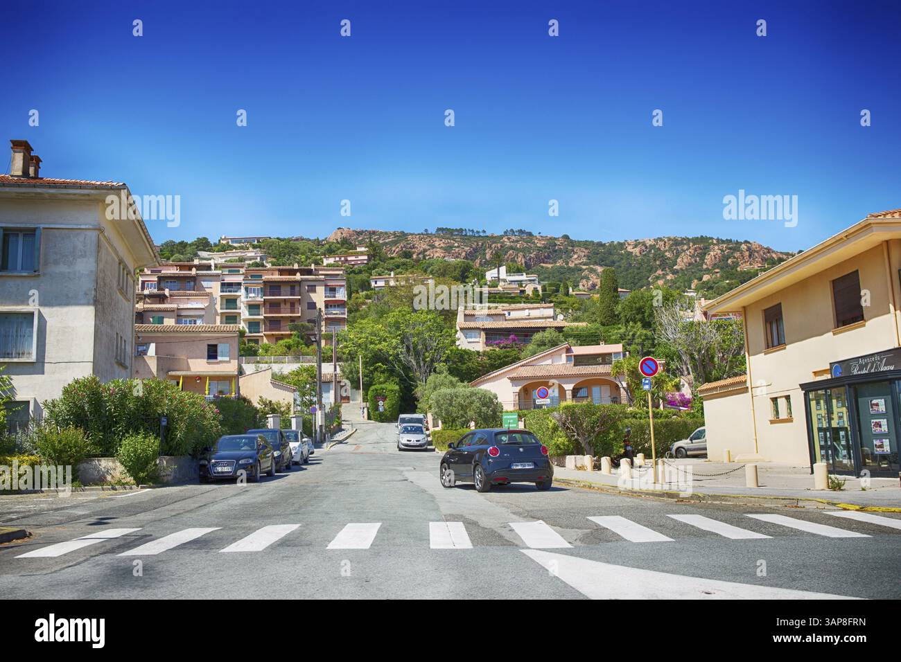 Zebra crossing on an empty road in the south of France in summer Stock ...