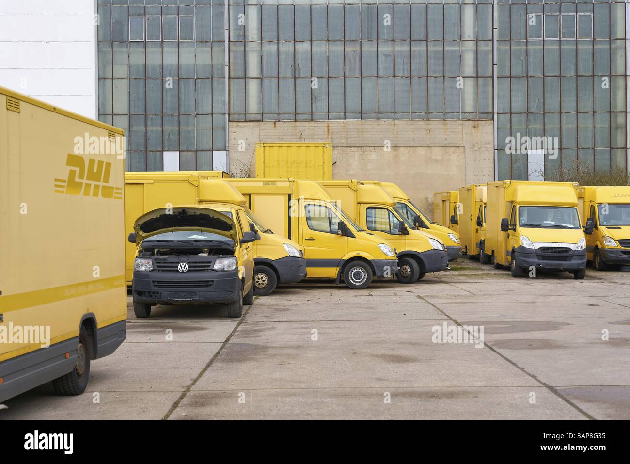 Discarded DHL vehicles that are no longer roadworthy in the yard of a ...