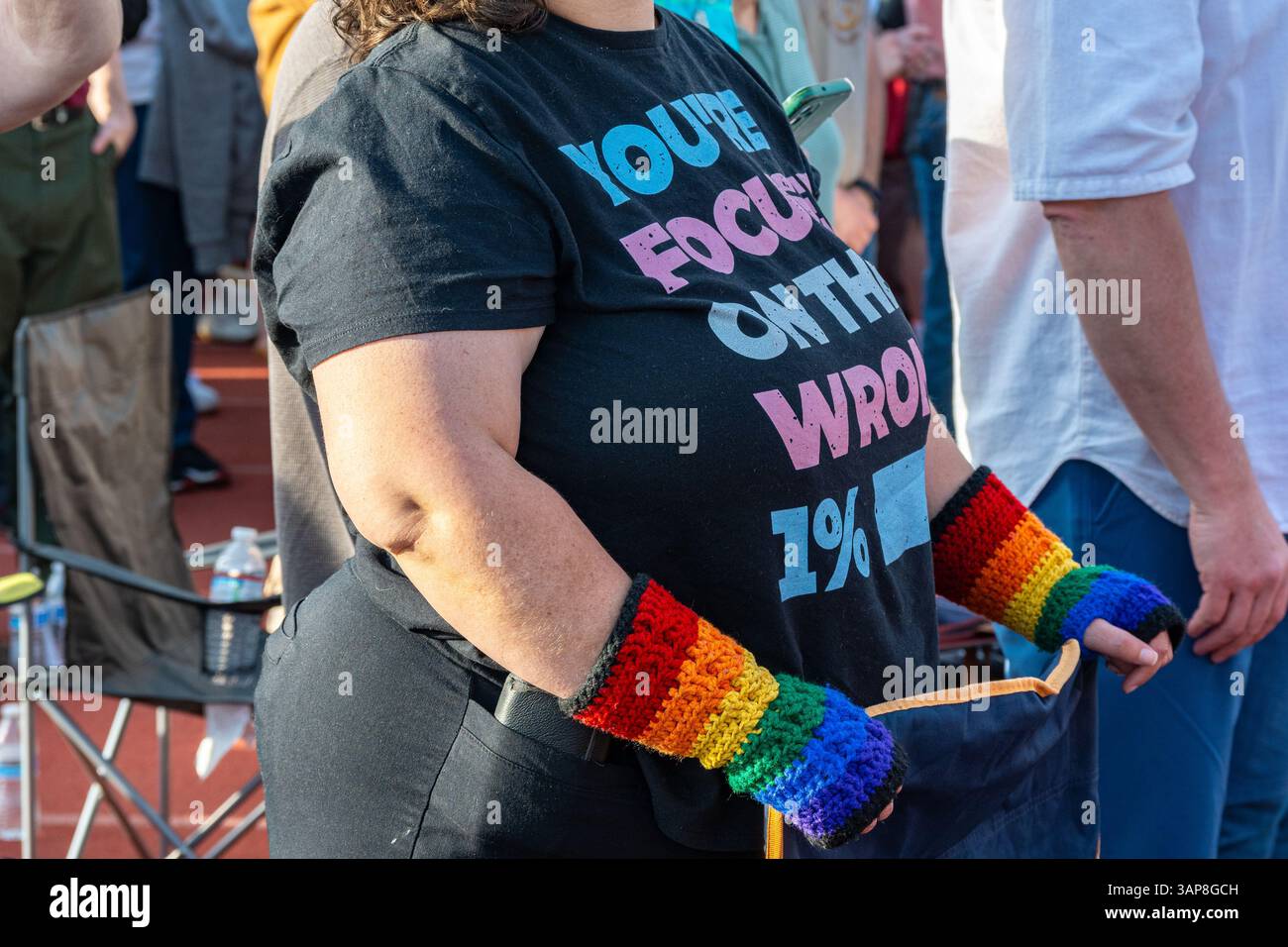 A person wearing a trans-related t-shirt at a political rally at Folsom ...