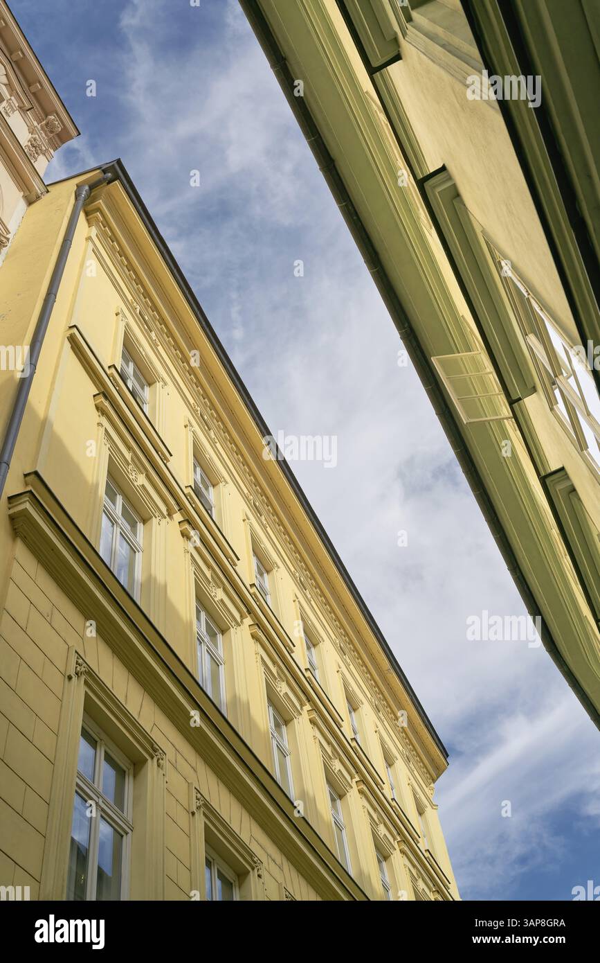 View upwards between renovated old residential buildings in the city ...