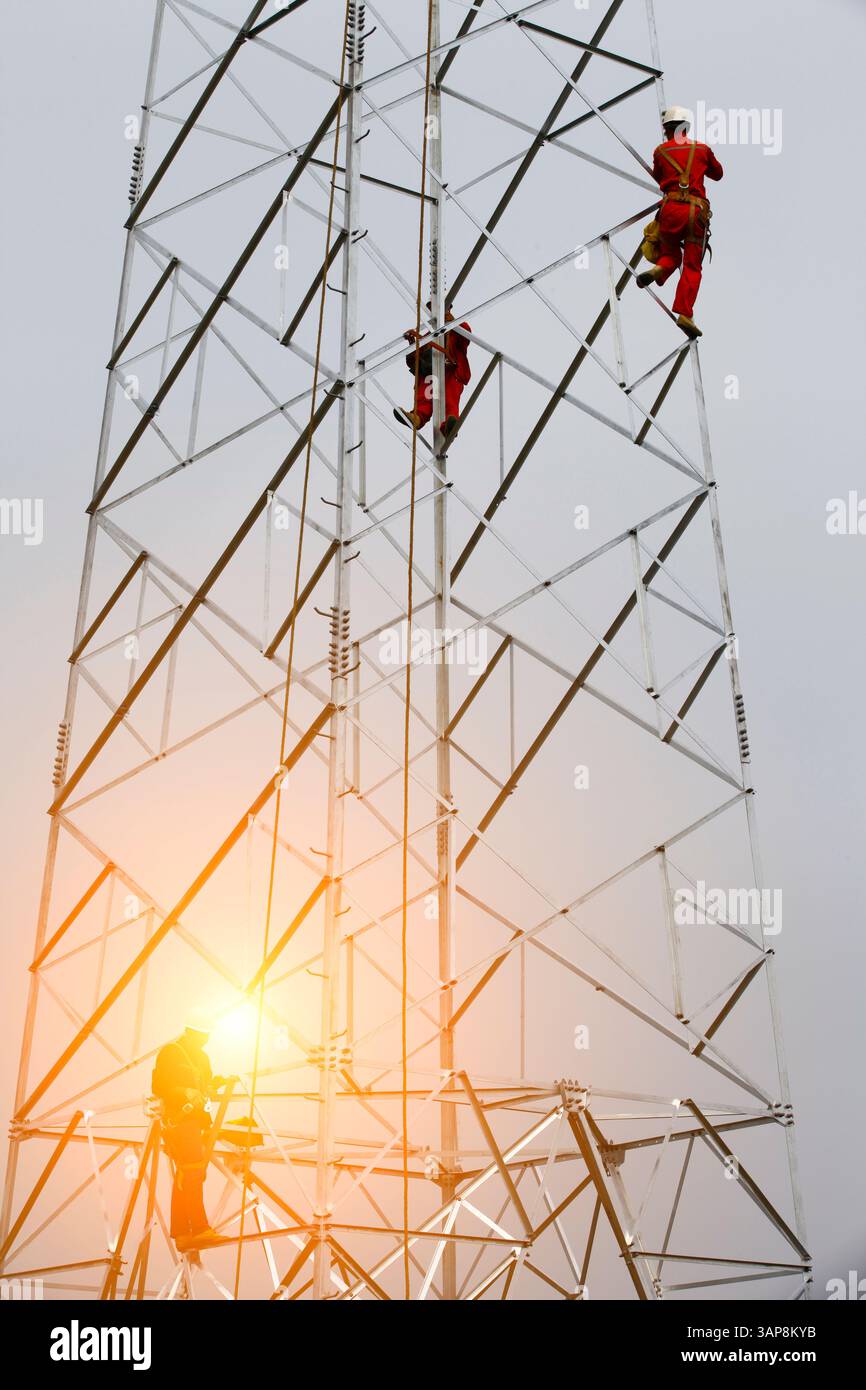 The workers of the pylon Stock Photo - Alamy