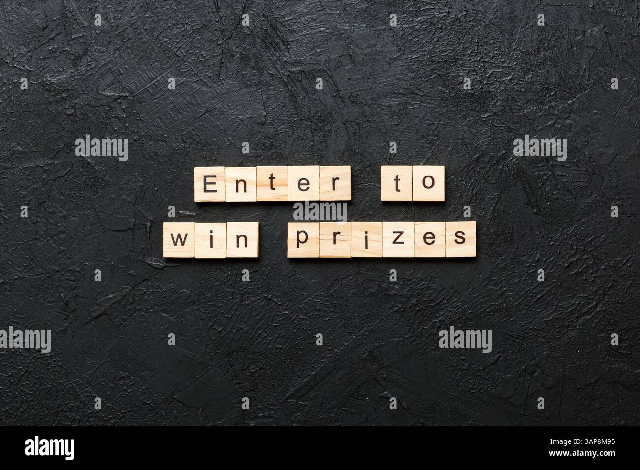 Enter to win prizes word written on wood block. Enter to win prizes ...