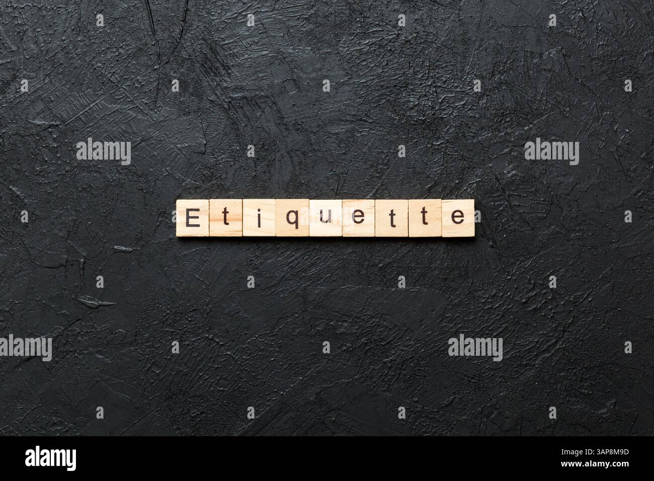 ETIQUETTE word written on wood block. ETIQUETTE text on cement table for your desing, concept ...