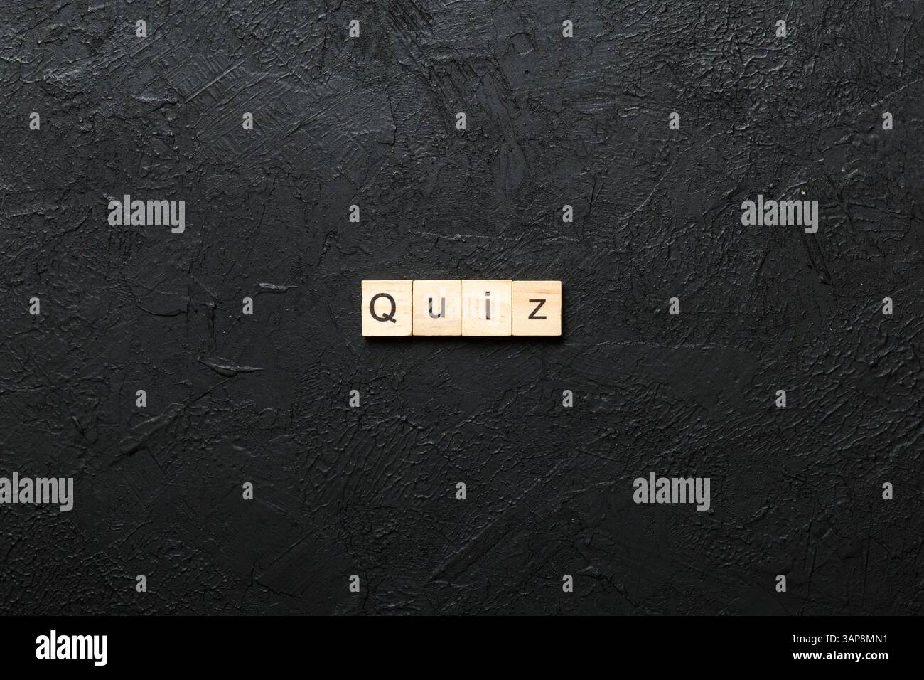 Quiz word written on wood block. Quiz text on cement table for your ...