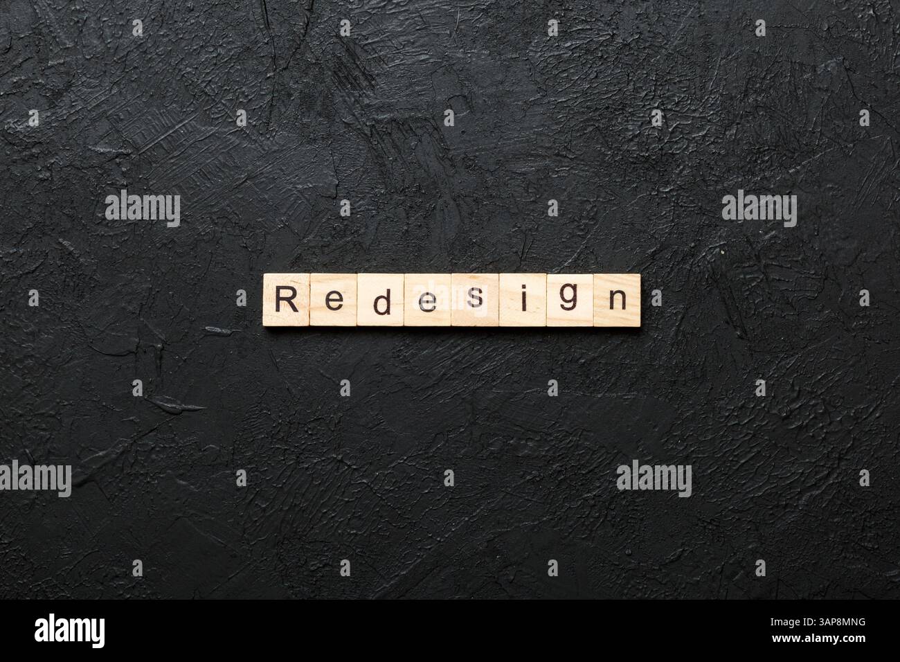 REDESIGN word made with wooden blocks concept Stock Photo - Alamy