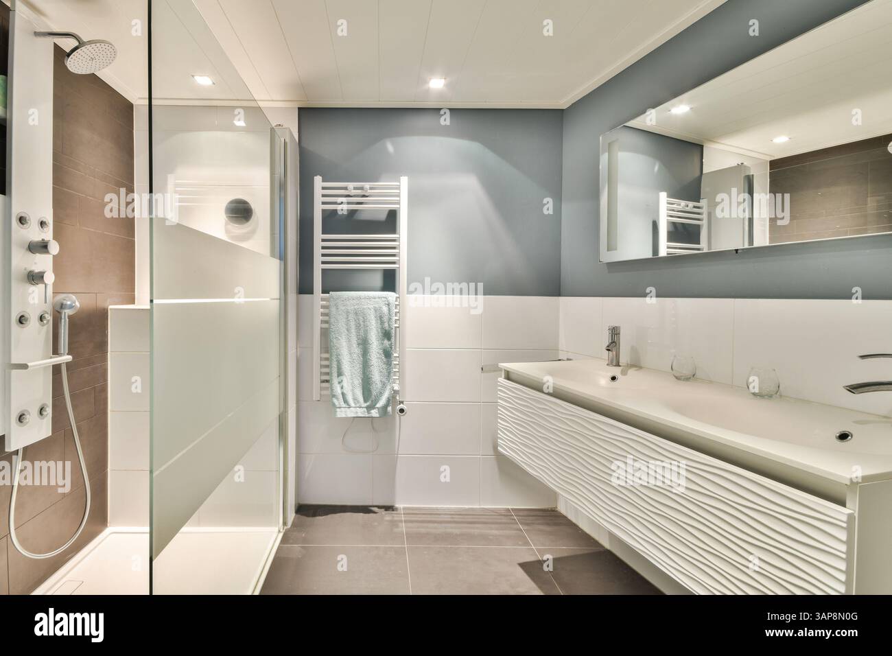 A sleek and contemporary bathroom featuring a clean design with elegant ...