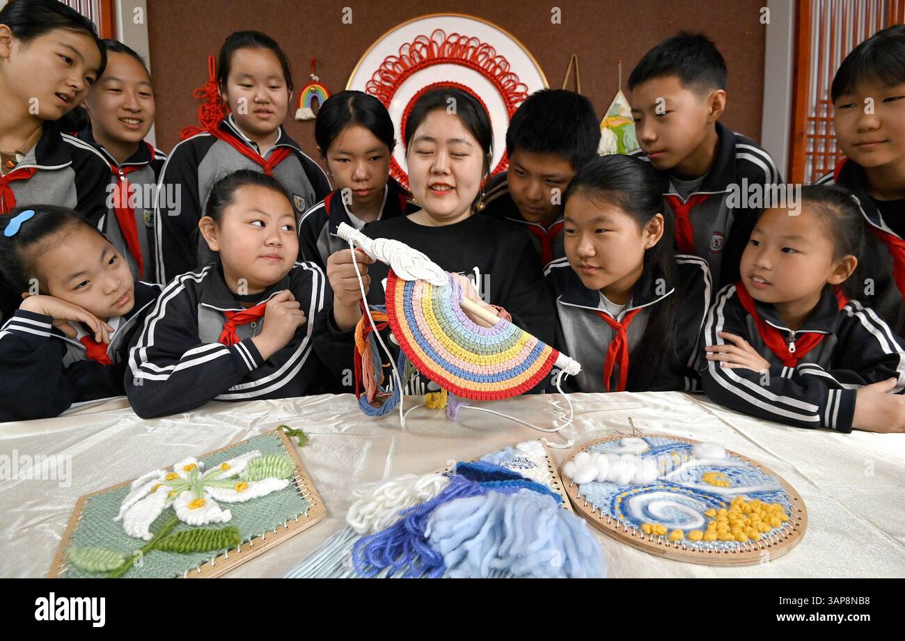 HANDAN, CHINA - APRIL 16, 2025 - Students weave knot crafts at Railway ...