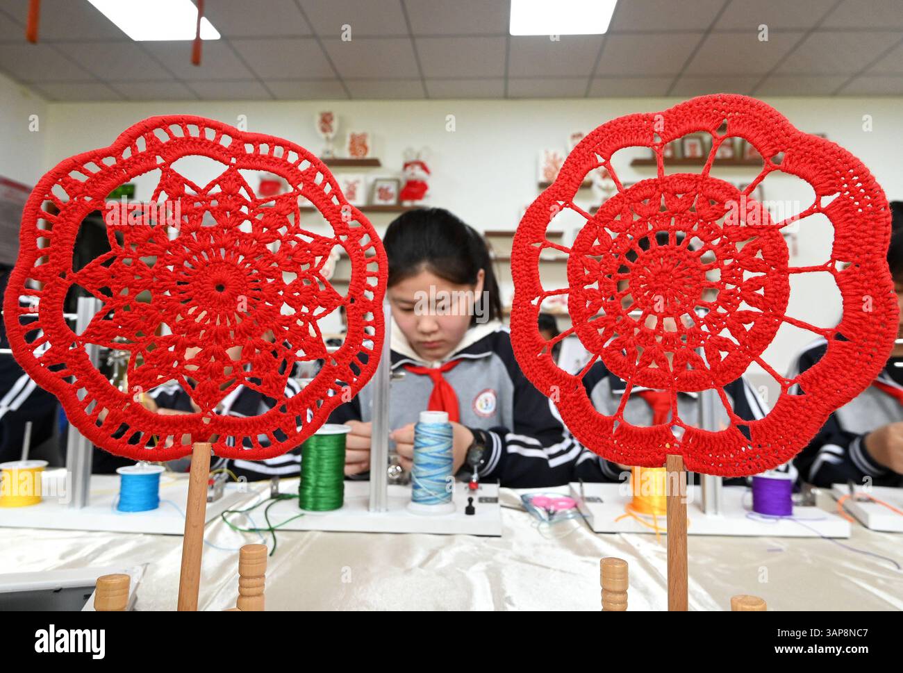 HANDAN, CHINA - APRIL 16, 2025 - Students weave knot crafts at Railway ...