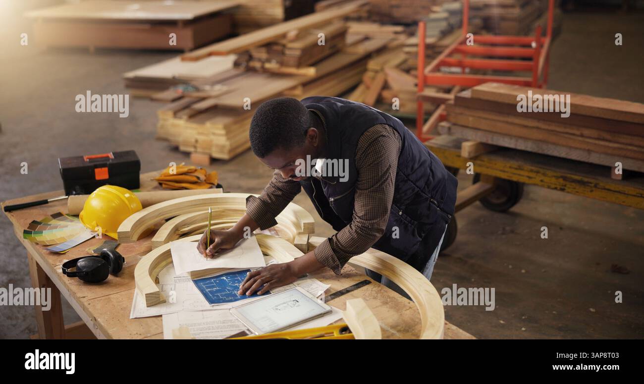 Furniture, blueprint and drawing with black man in factory for ...
