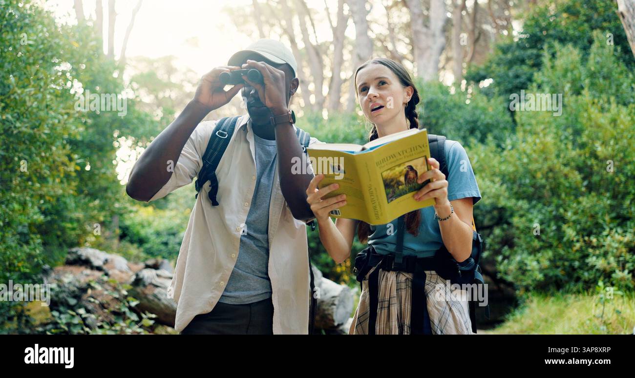 Binoculars, travel and people with birdwatching in forest, book for info and knowledge of ...