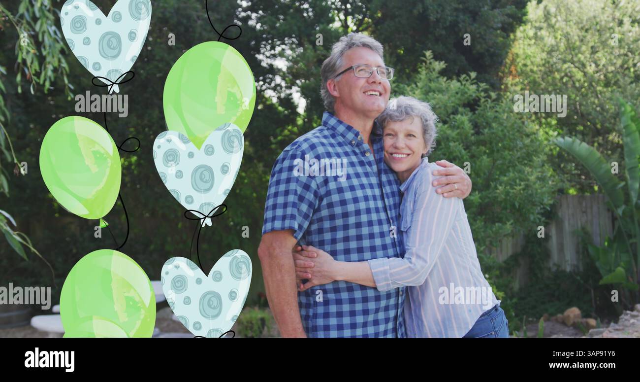 Image of balloons over smiling caucasian grandparents hugging in garden ...